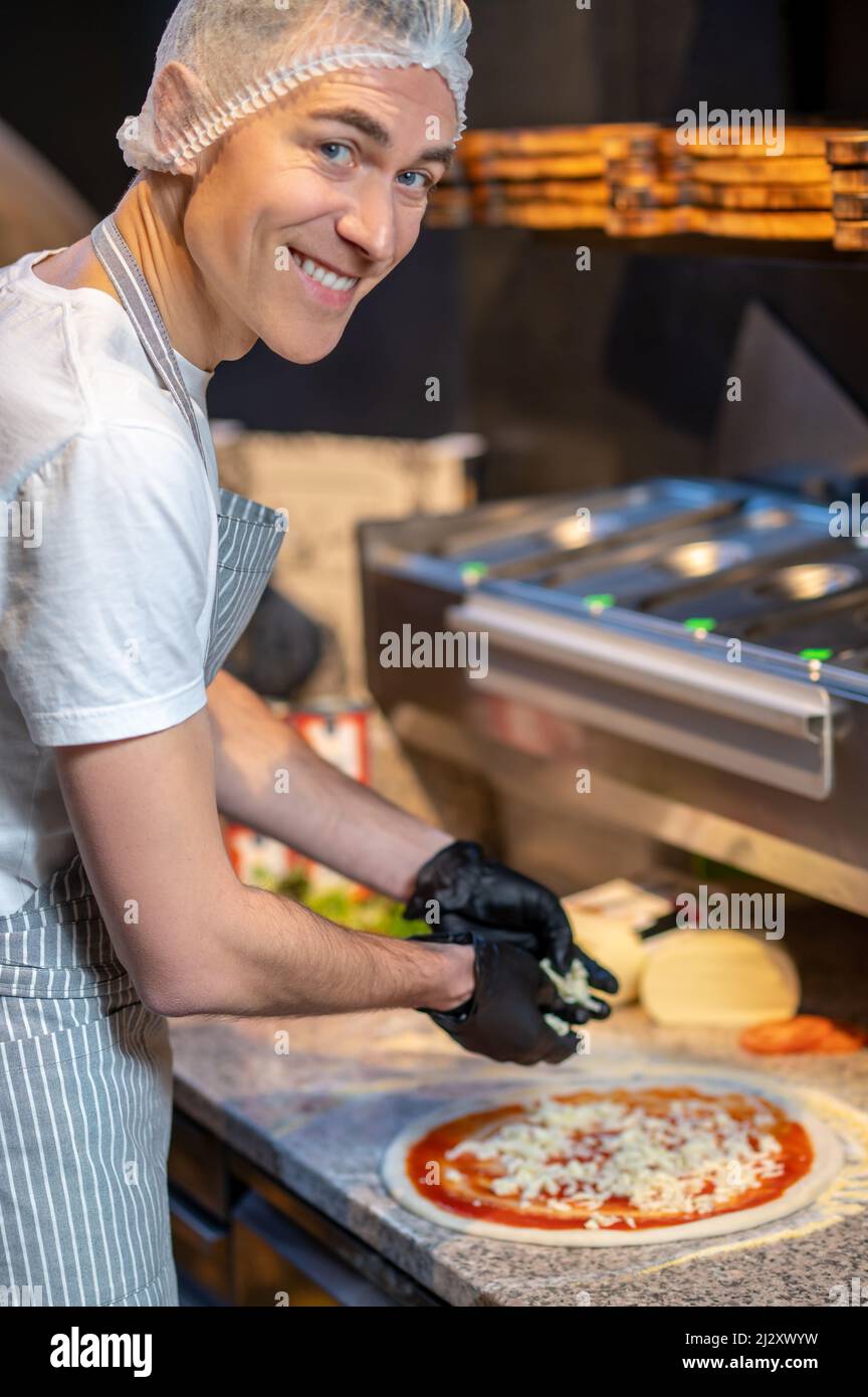 Chef baking pizza in the italian pizzeria Stock Photo - Alamy