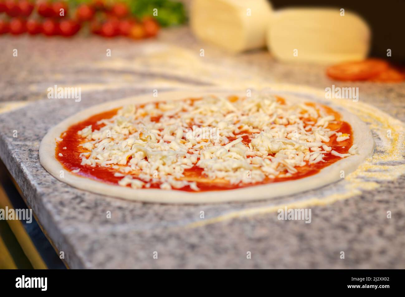Chef baking pizza in the italian pizzeria Stock Photo - Alamy