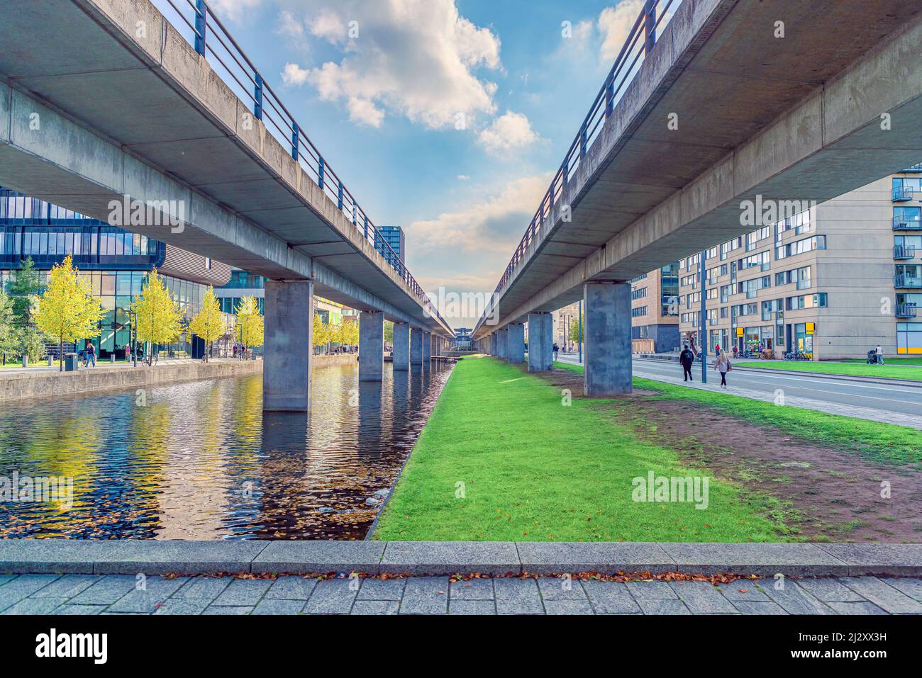 two bridges of the M1 metro subway line and a canal with water near ...
