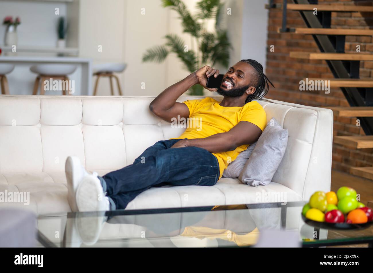 Man reclining on sofa hi-res stock photography and images - Alamy