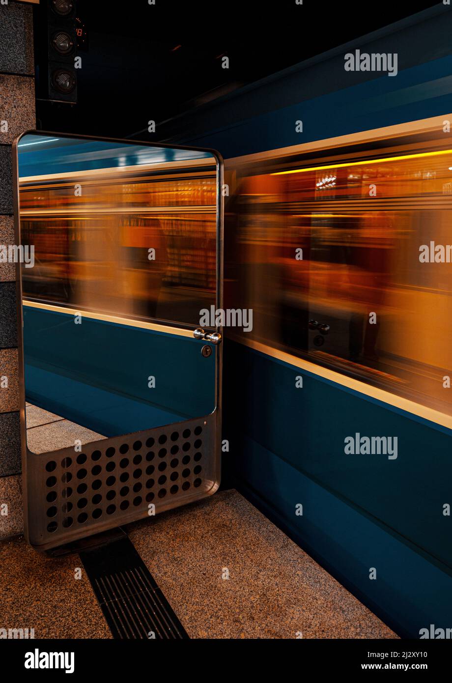 vertical shot of subway train leaving the station Stock Photo - Alamy
