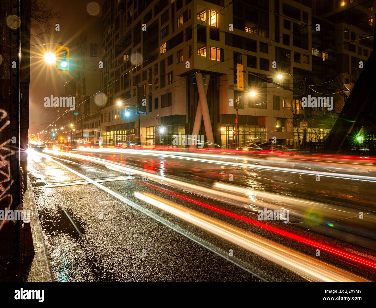 Busy downtown traffic at night Stock Photo - Alamy
