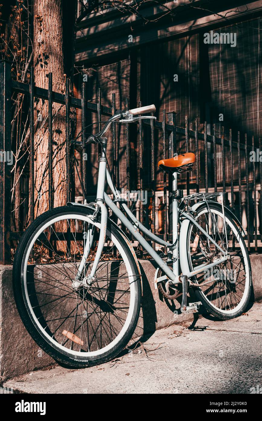 Bicycle resting fence hi-res stock photography and images - Alamy