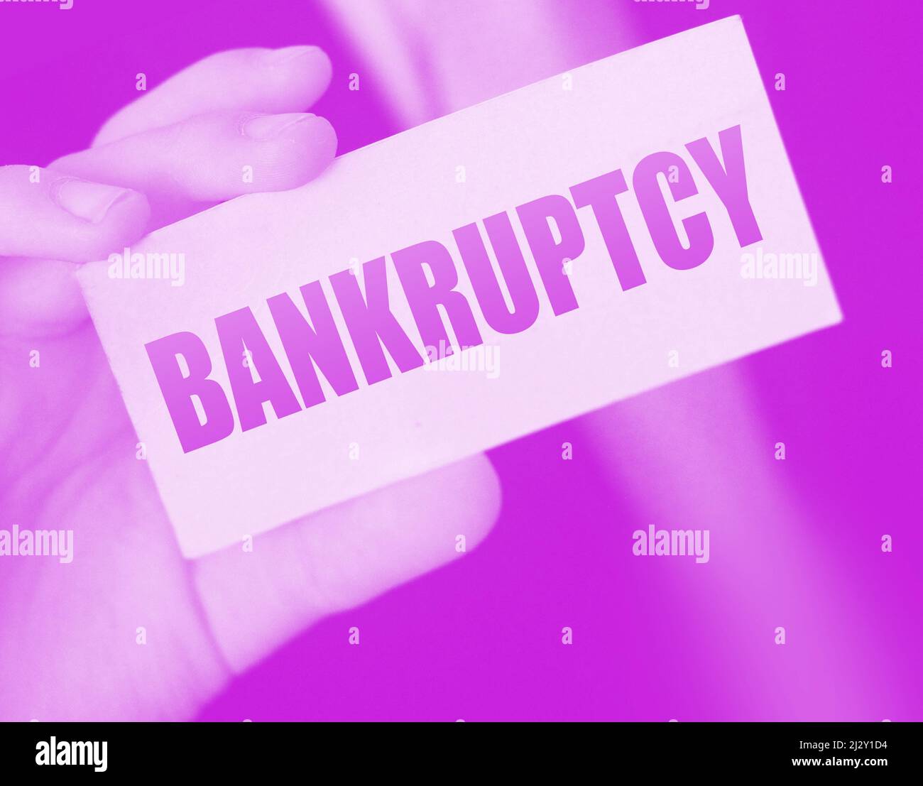 Bankruptcy on a card. Businessman holding a card with word Bankruptcy ...