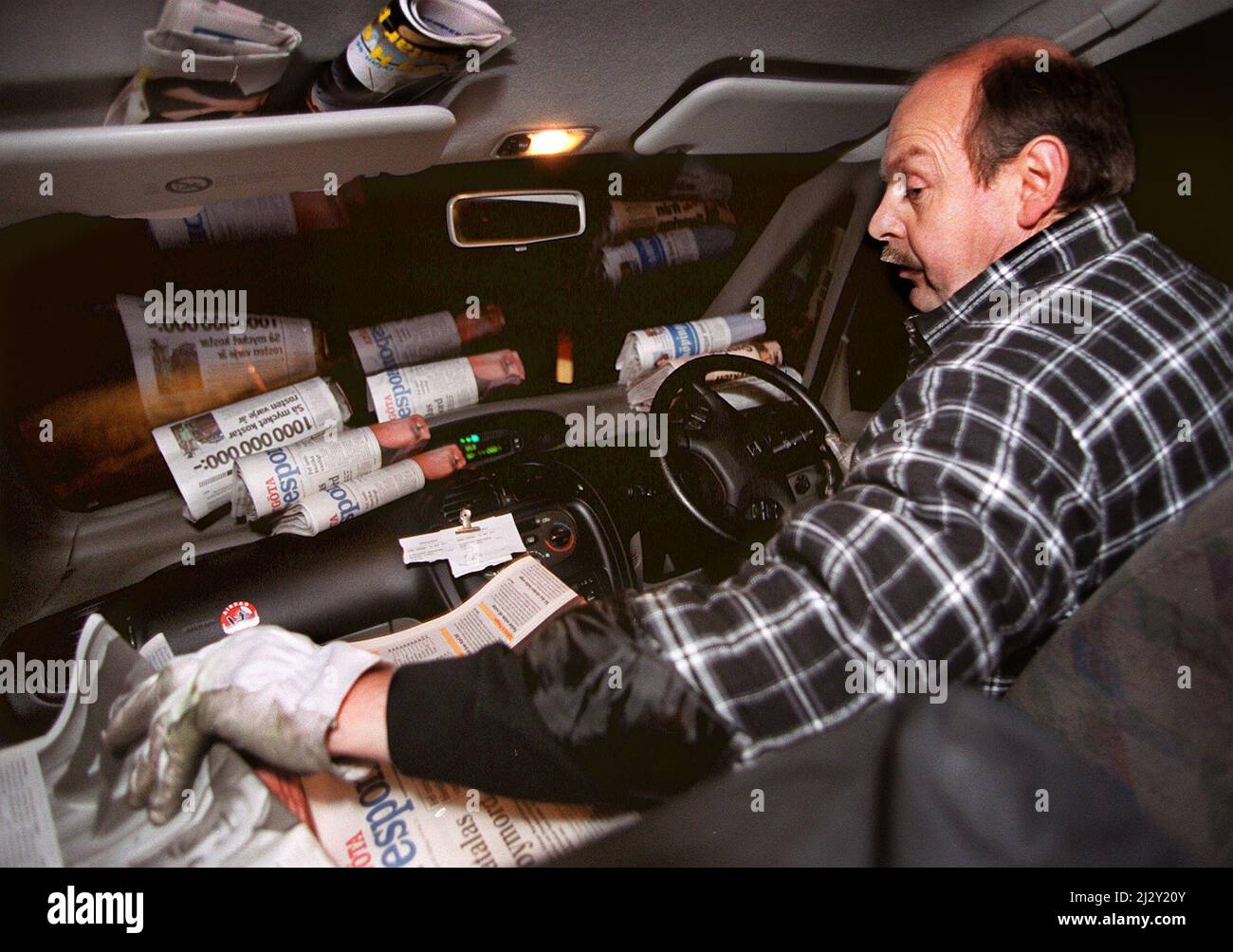 A newspaper carrier in his car Stock Photo - Alamy