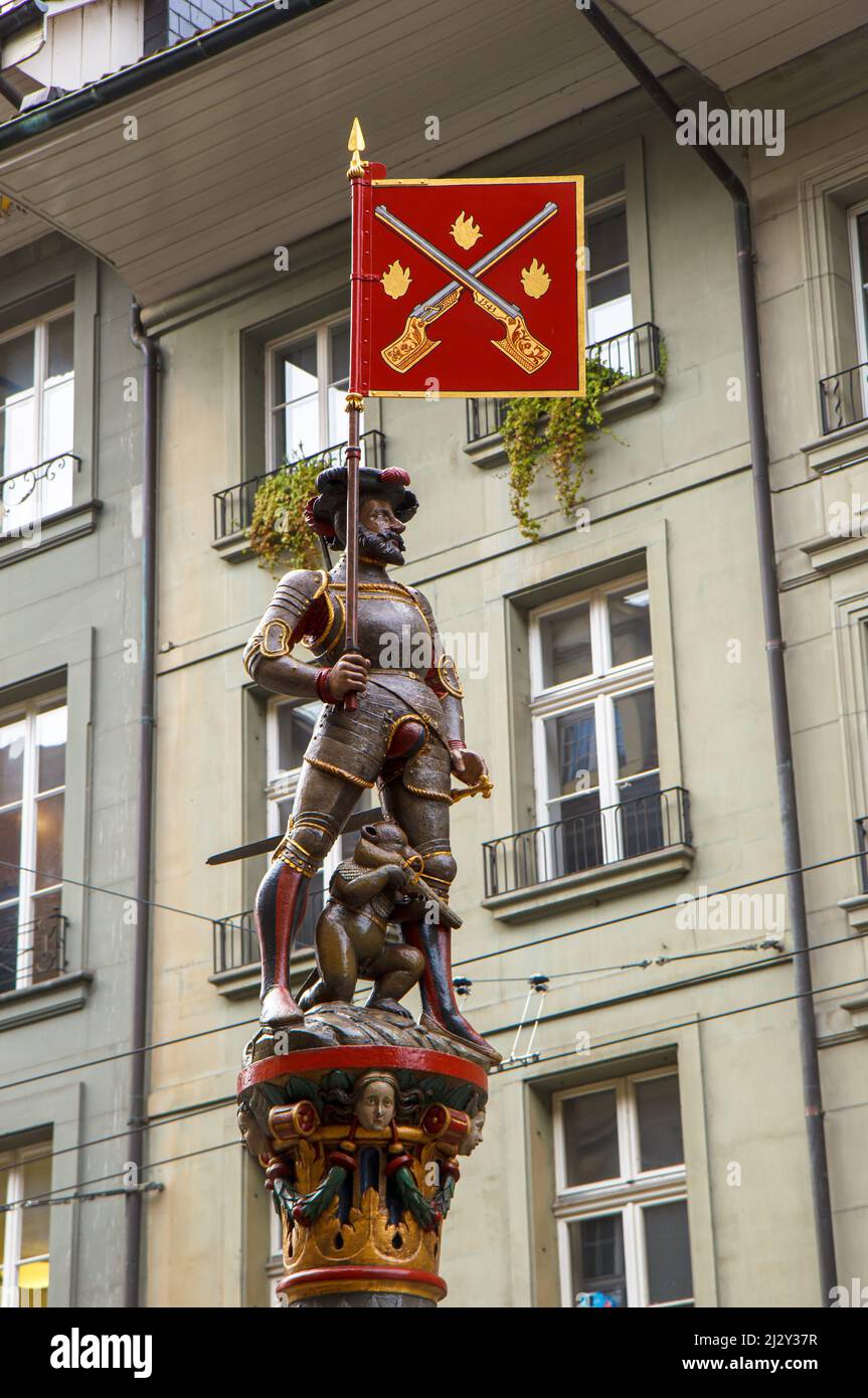 A vertical closeup of a Schutzenbrunnen, a marksman on a medieval ...