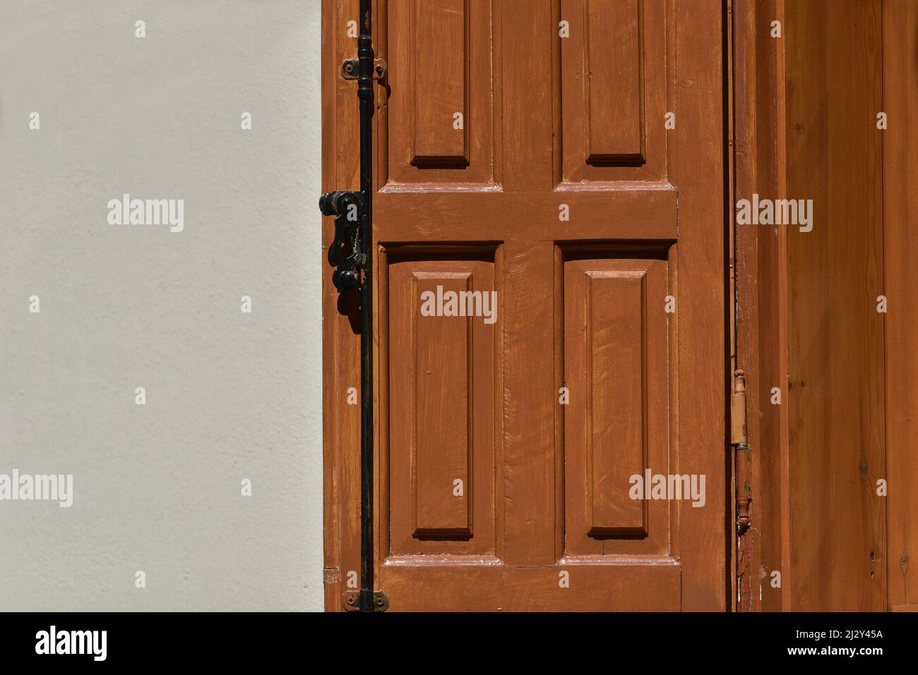 Traditional rural house brown wooden window shutters with a metal ...