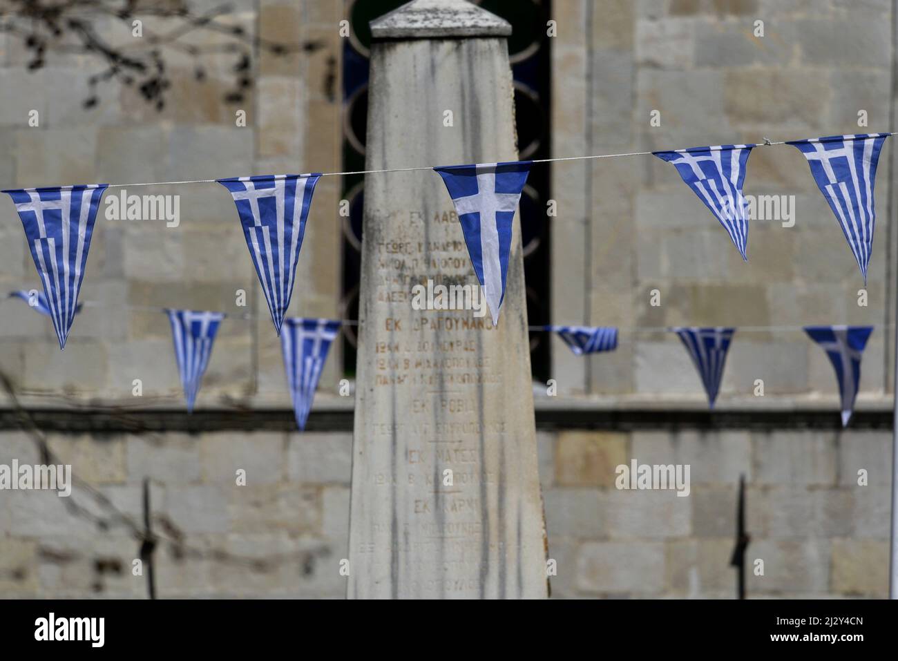 Festive Greek flags hanging on the main square of Andritsaina ...