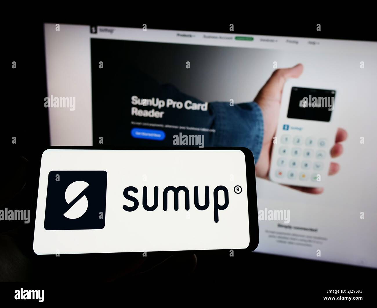 Person holding mobile phone with logo of British fintech company SumUp ...