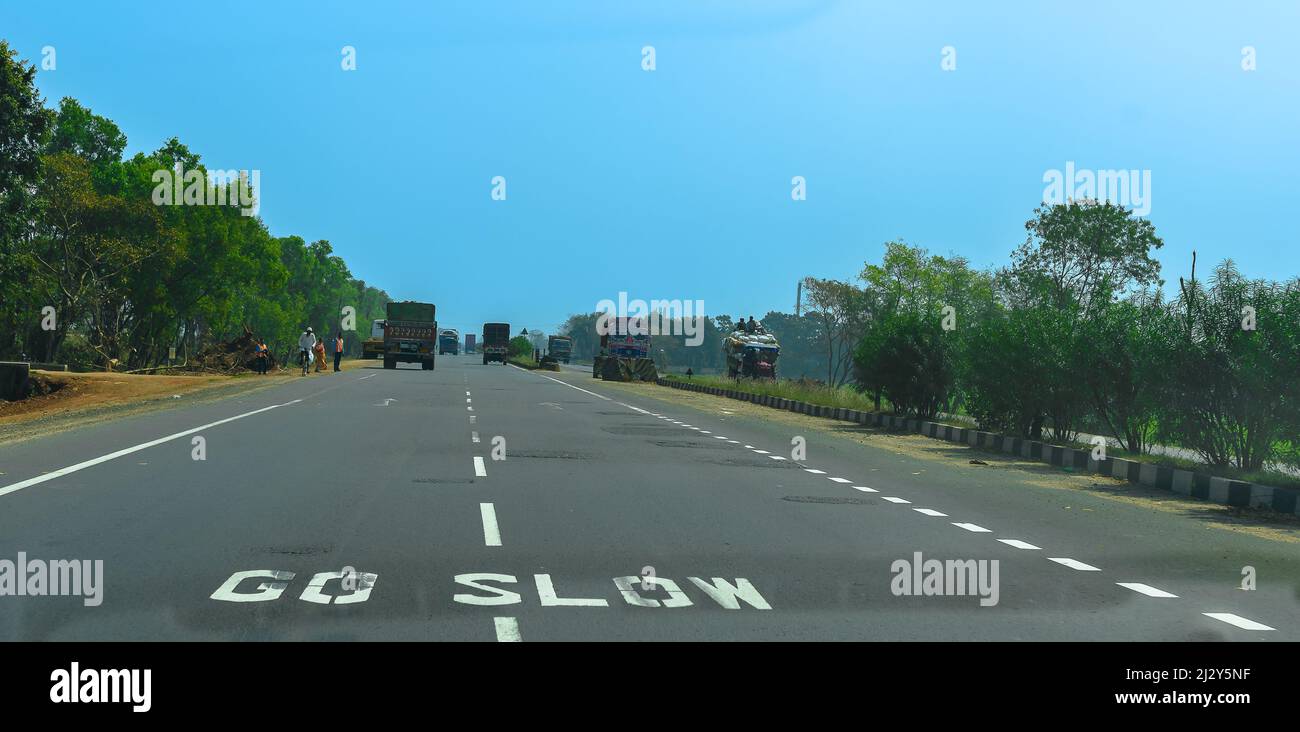 Landscape View of Indian National Highway with GO SLOW sign. Selective ...