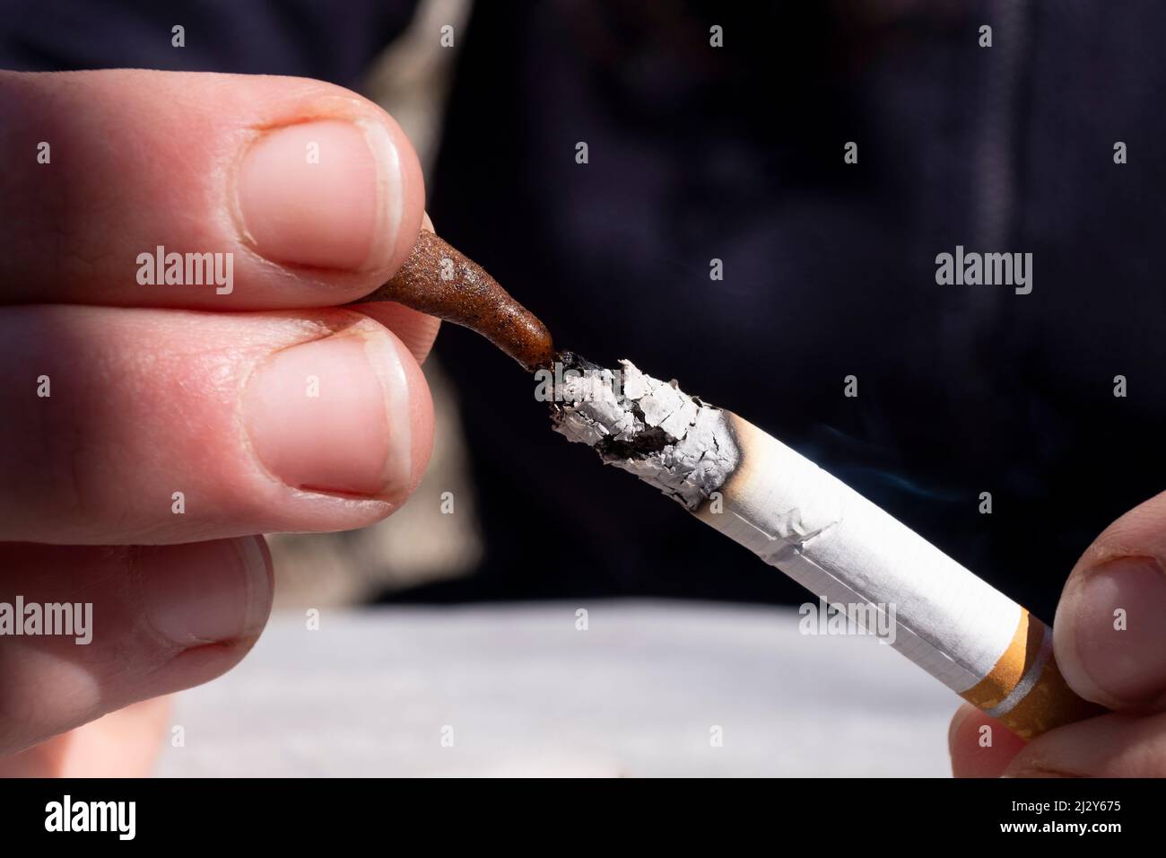 smoking hashish through a cigarette,smoking high THC cannabis Stock ...