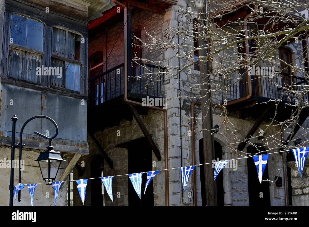 Festive Greek flags hanging on the main square of Andritsaina ...
