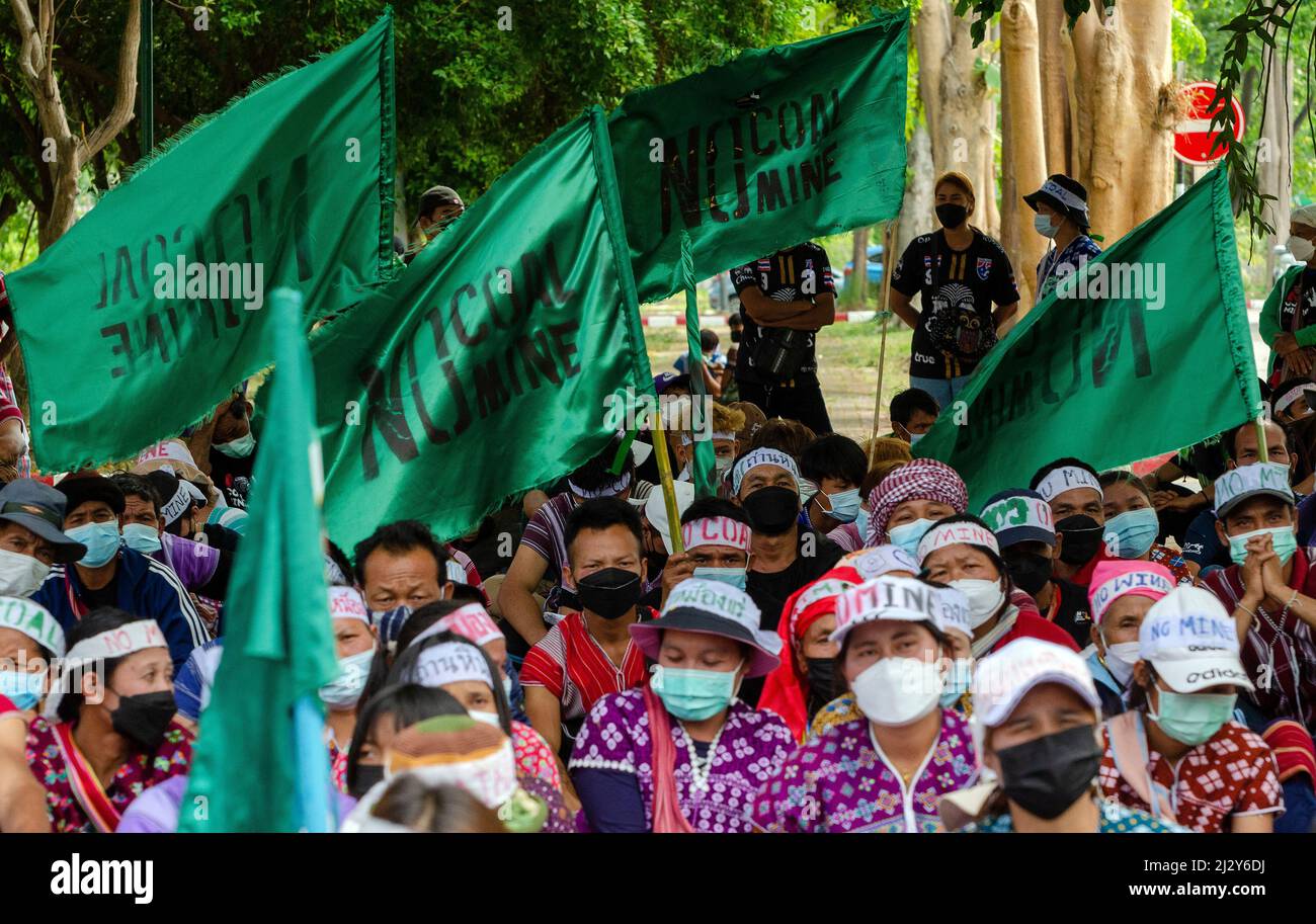 Protesters hold green flags during the protest against a coal mine ...