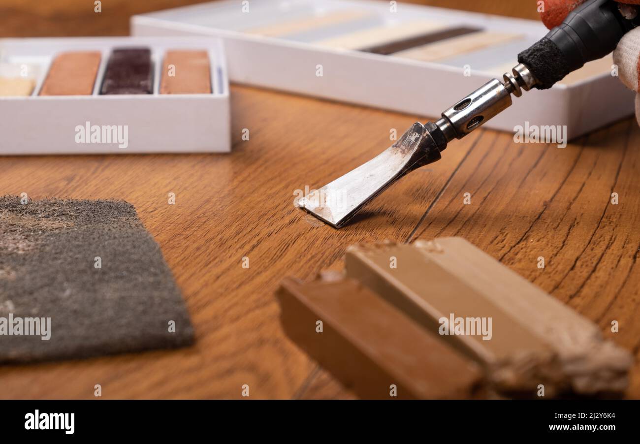 floor restoration with wax,repair of defects on laminate, parquet ...