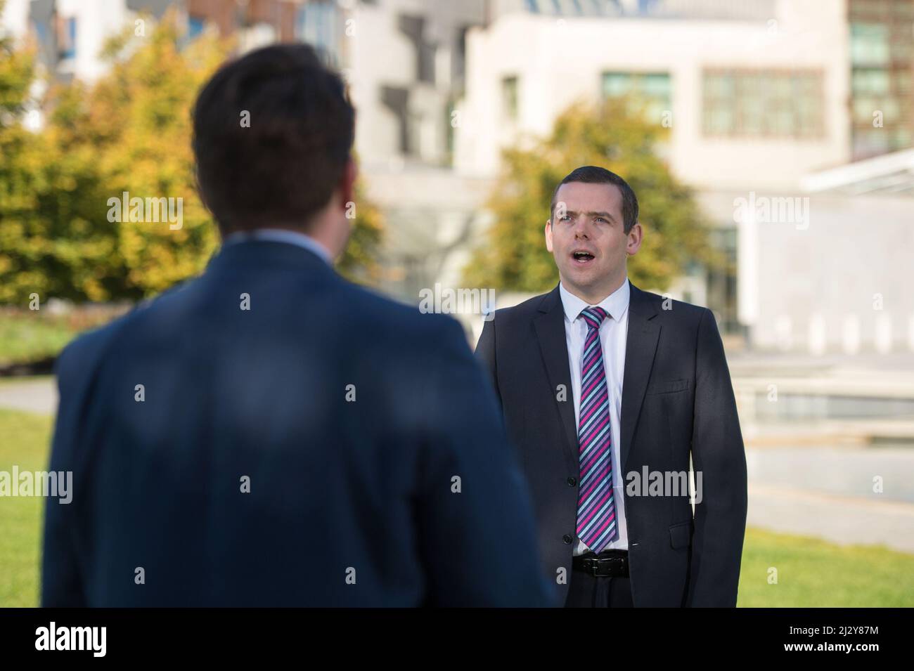 Douglas ross talking to person scottish parliament hi-res stock ...