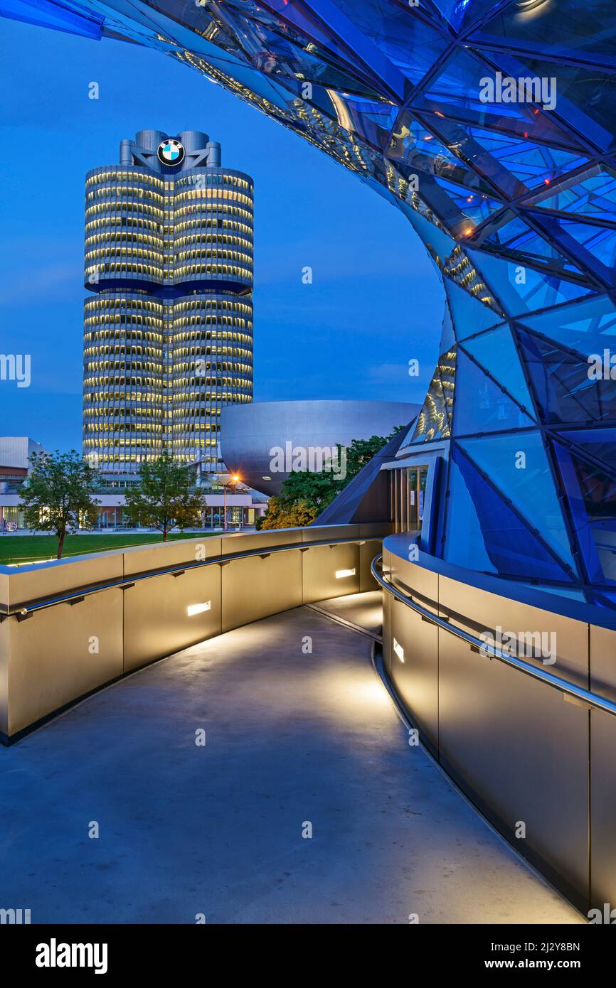 Blue illuminated BMW Welt building with BMW four-cylinder and BMW ...