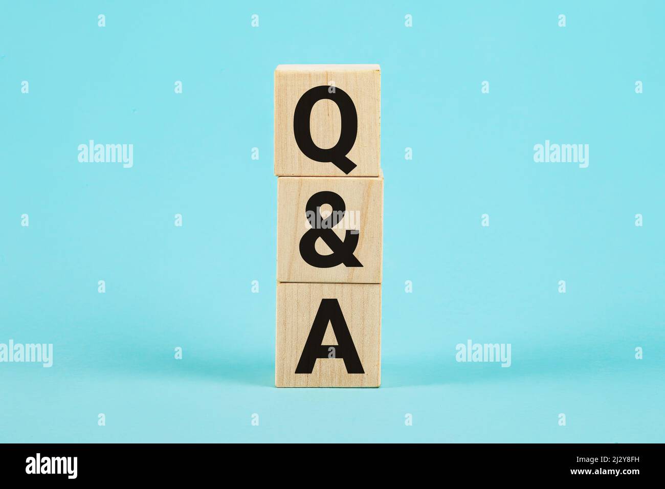 Q and A - acronym from wooden blocks with letters, questions and ...