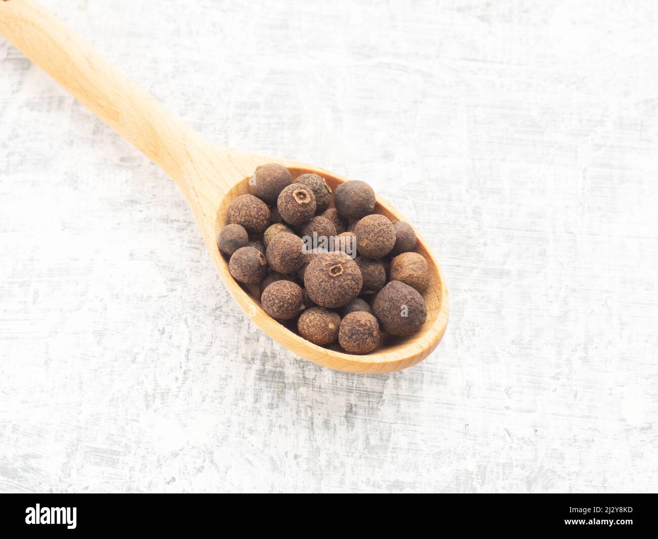 Spice Allspice (Jamaica pepper, Pimento) in wooden spoon on white ...