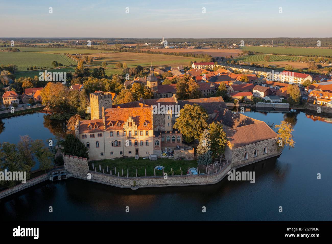Flechtingen moated castle in the evening sun, built in the 13th century ...