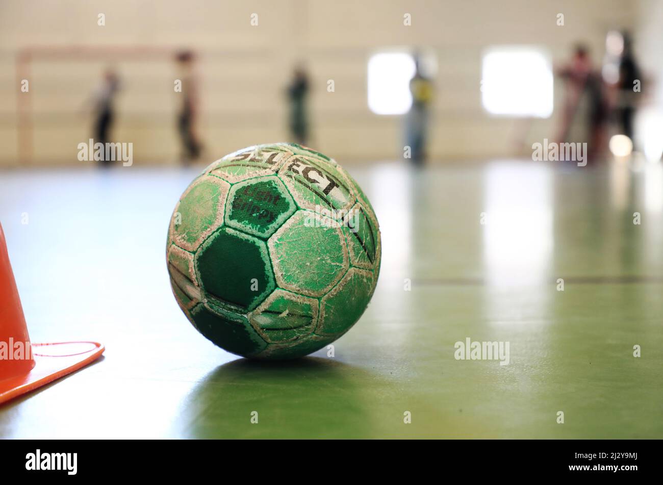 Students from a school during a sports lesson in a sports hall. Here is ...