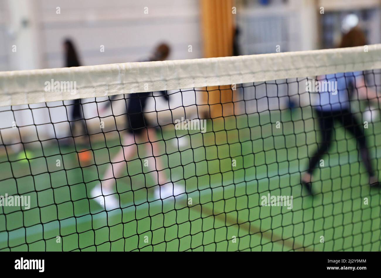 Students from a school during a sports lesson in a sports hall. Here is ...