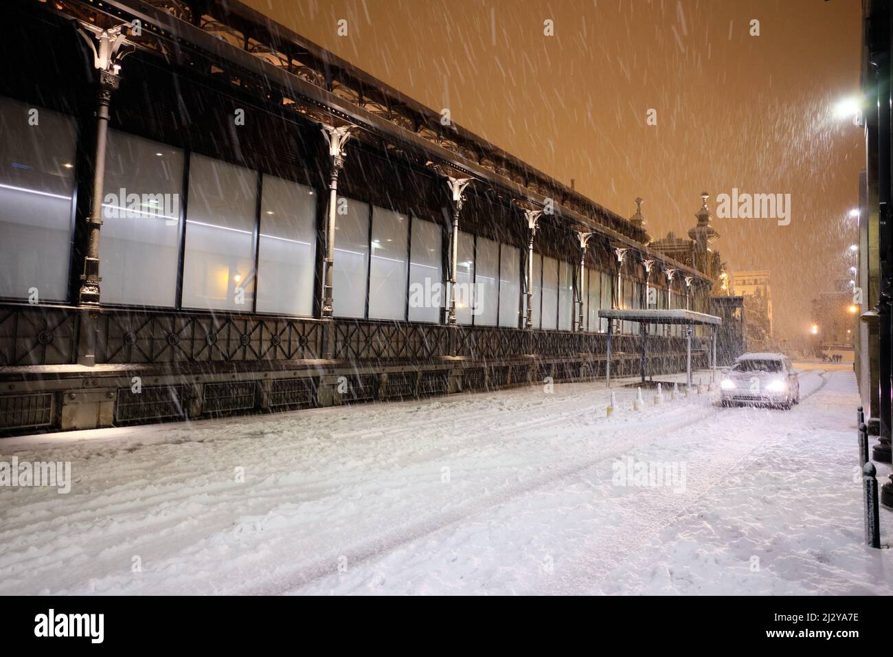 Illuminated old building on a snowy night Stock Photo - Alamy