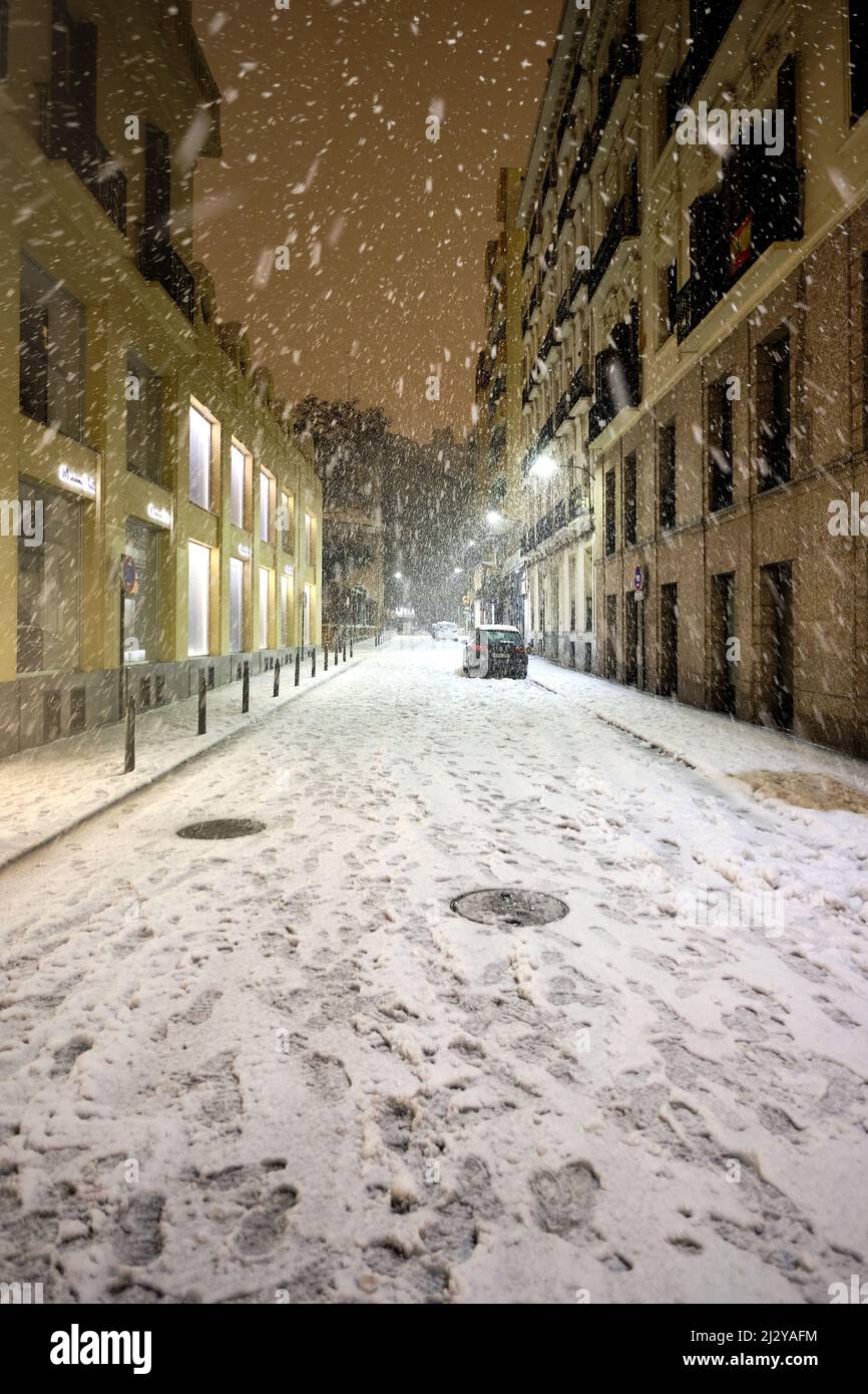 Vertical image of a city at night in a winter storm Stock Photo - Alamy