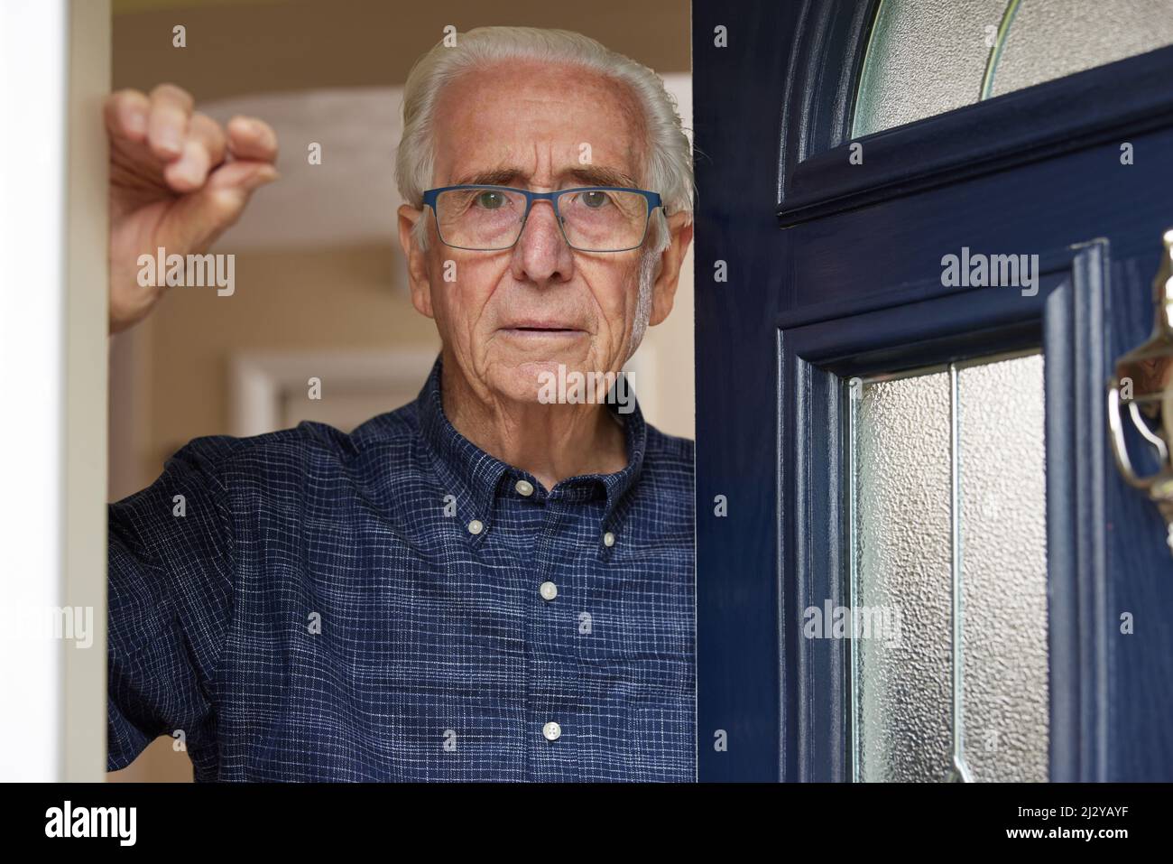 Person opening door scared hi-res stock photography and images - Alamy