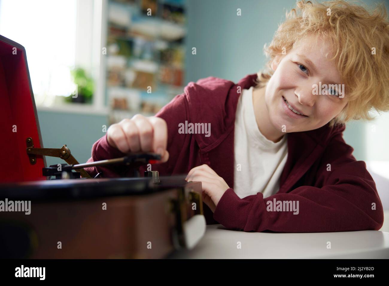 Portrait Of Teenage Girl Playing Vinyl Records On Record Player At Home ...