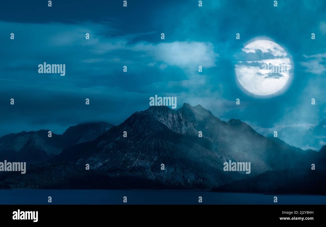 Magical Night Scene with Full Moon in cloudy sky Stock Photo - Alamy