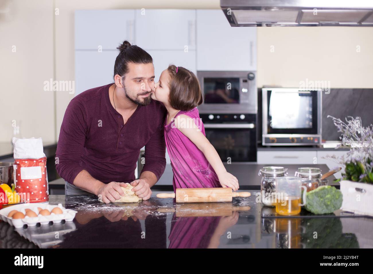 Father and children cooking dinner hi-res stock photography and images ...