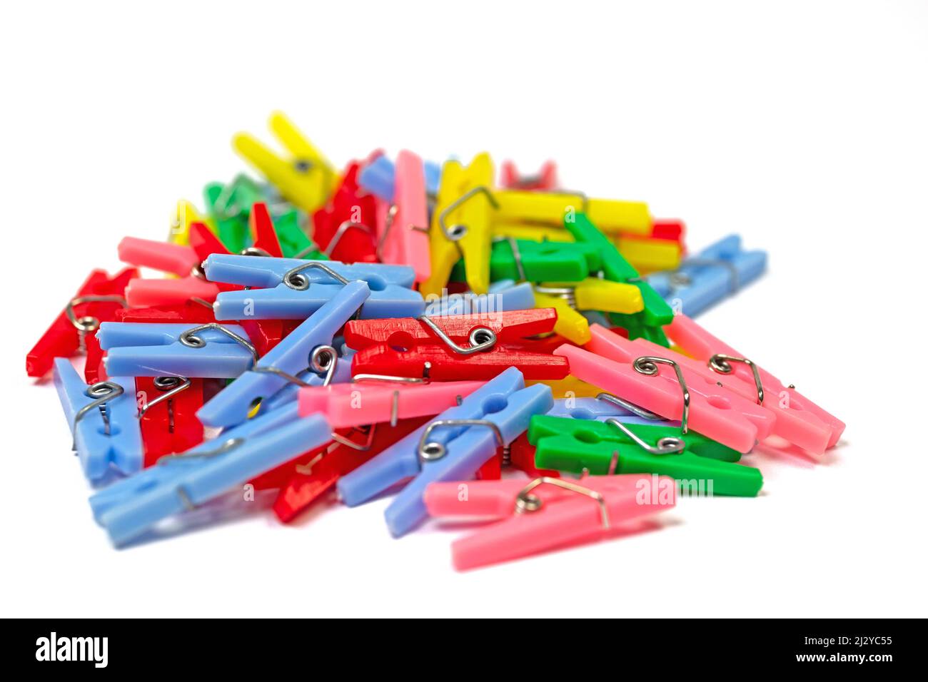 Colorful clothespins against white background Stock Photo - Alamy