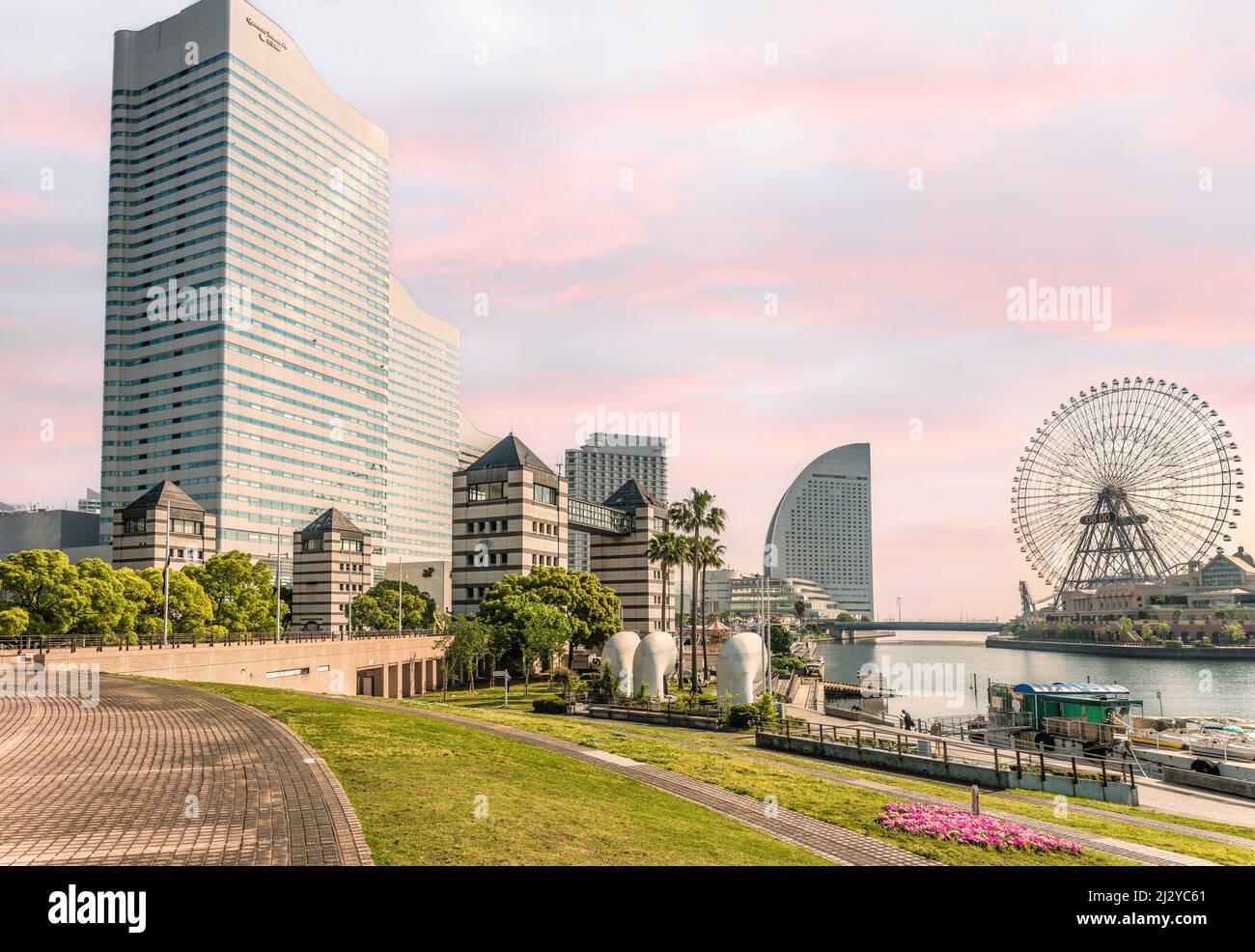 Yokohama skyline and lake promenade at Nippon Maru Memorial Park ...
