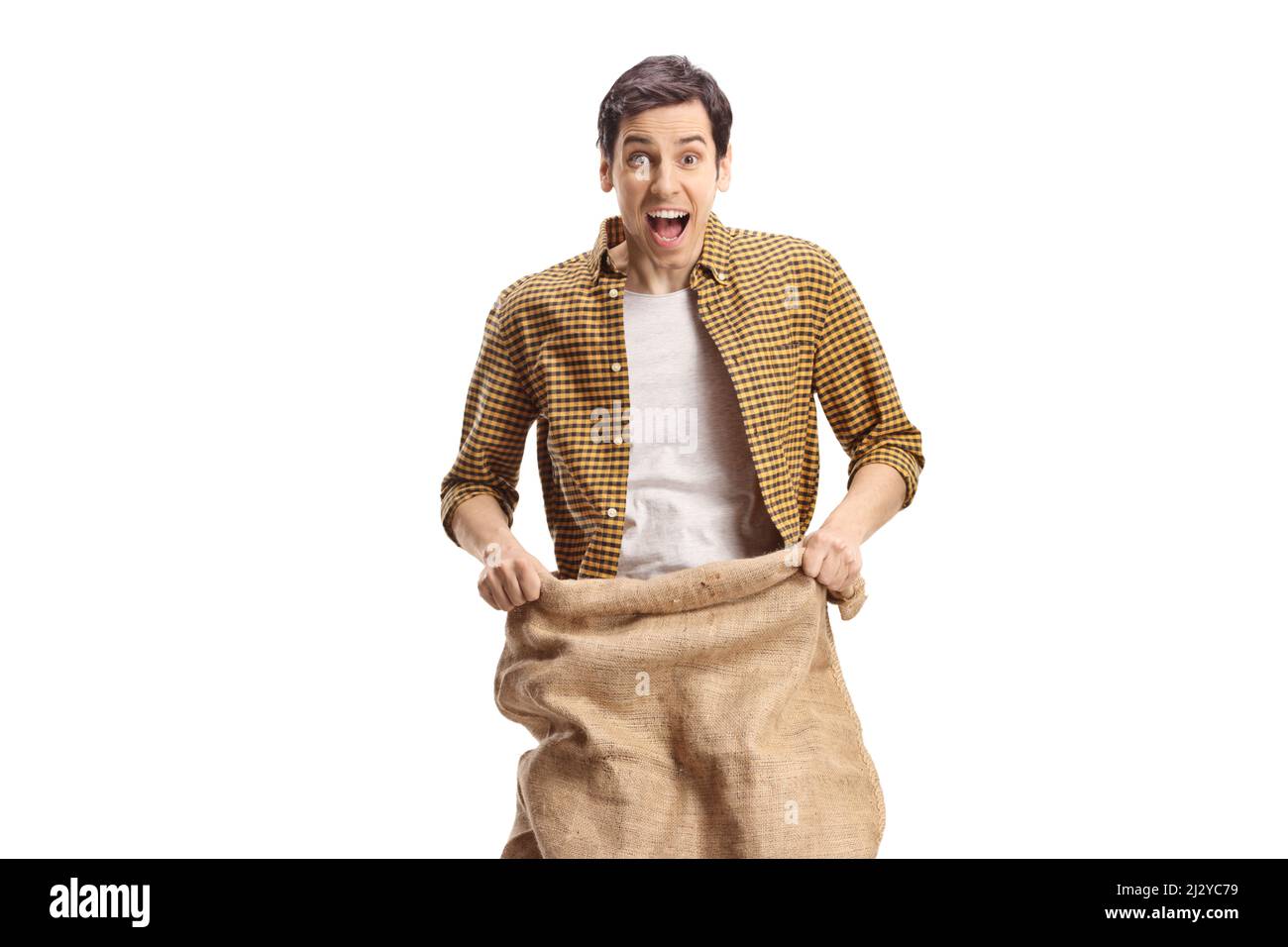 Excited young man jumping in a sack isolated on white background Stock ...