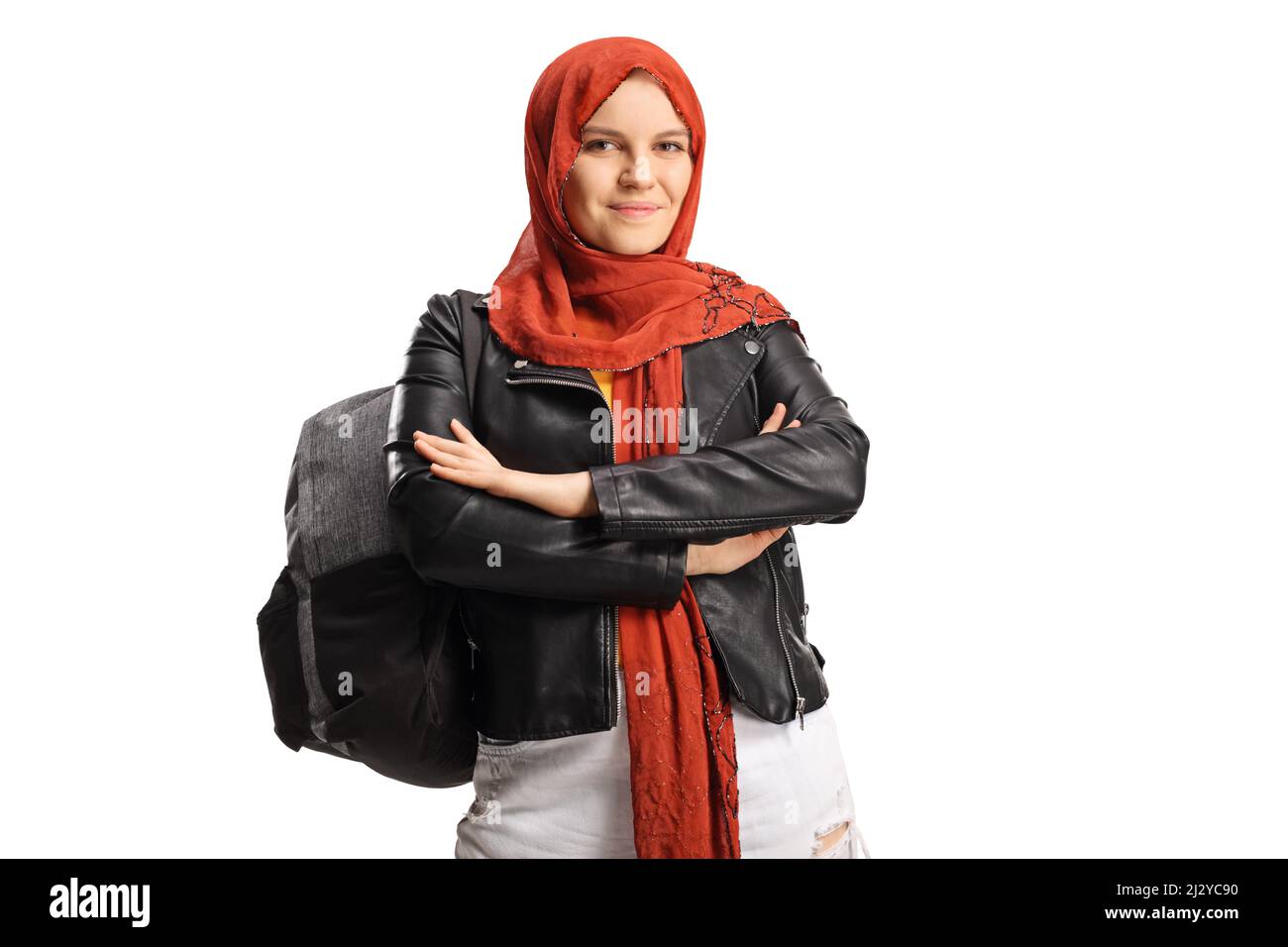 Female student with a hijab carrying a backpack and smiling at camera ...