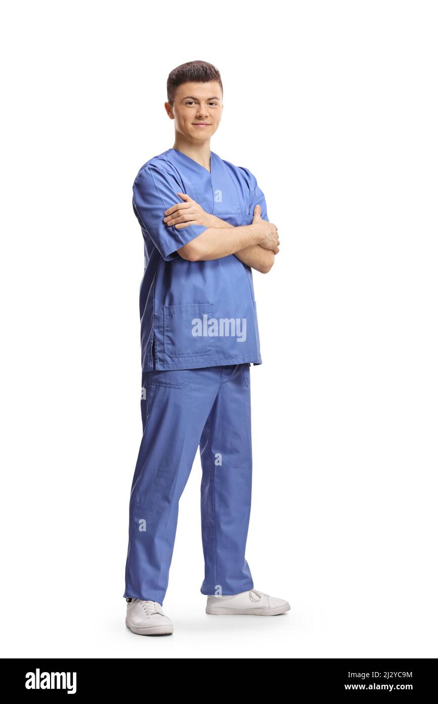 Full length shot of a young male intern worker in a blue uniform posing ...