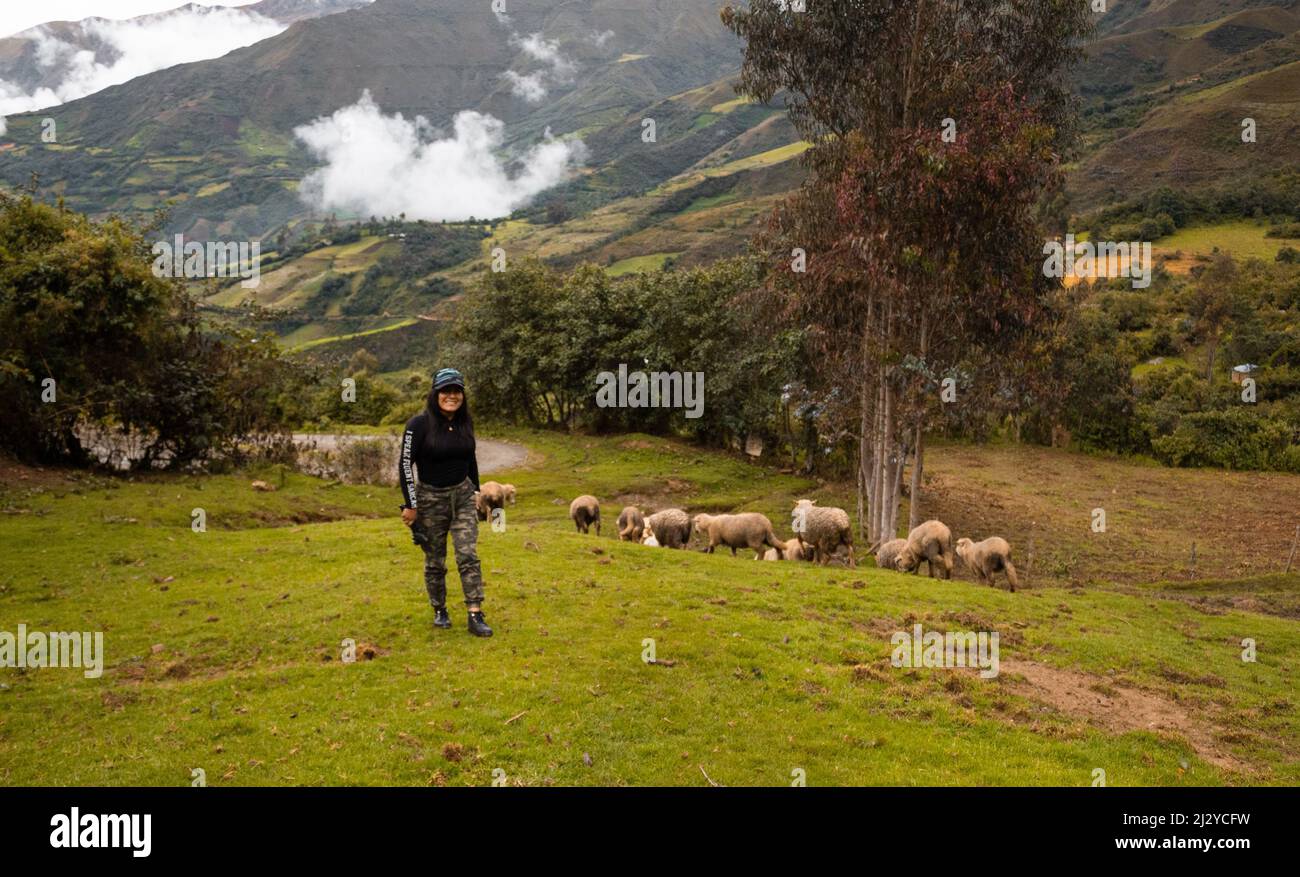 A young female walking in a beautifully scenic nature in the background ...