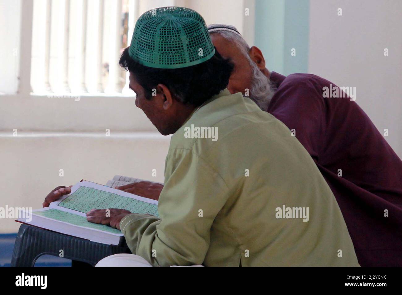 Faithful Muslims recite Holy Quran, at New Memon Mosque during Holy ...