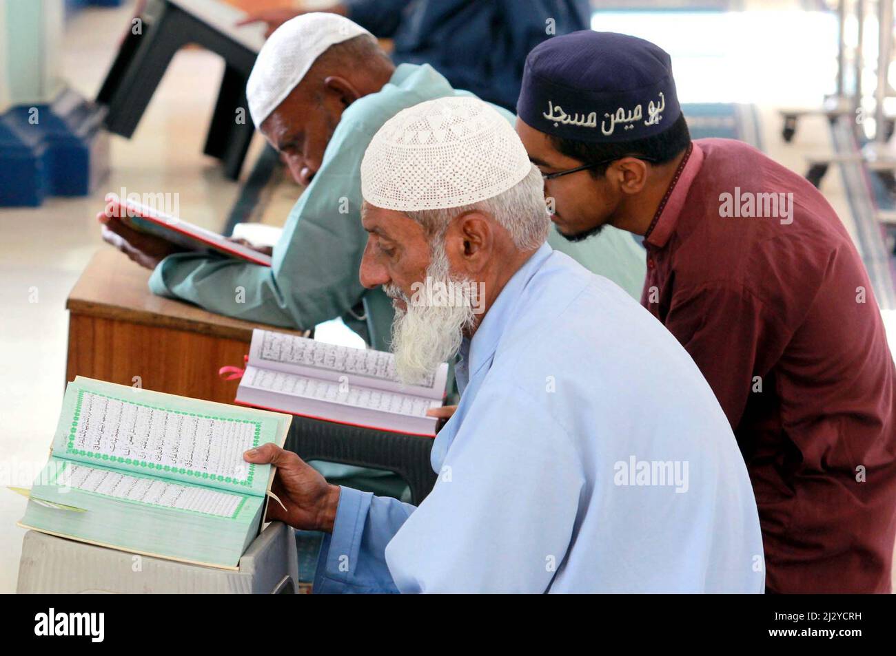 Faithful Muslims recite Holy Quran, at New Memon Mosque during Holy ...