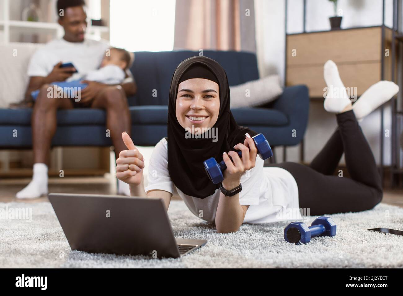 Indoor Sport Family Concept. Positive Arabic Muslim Woman In Hijab ...