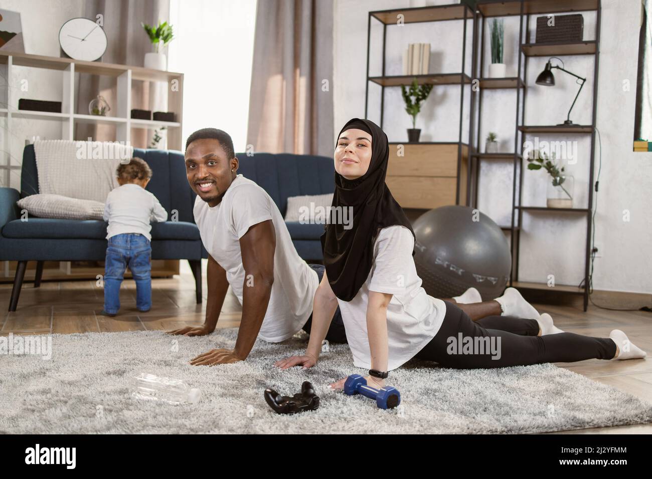 25-30 age beautiful sporty couple practicing yoga doing four-limbed ...