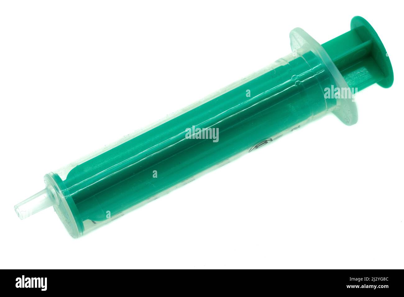 A green syringe isolated on a white background Stock Photo - Alamy