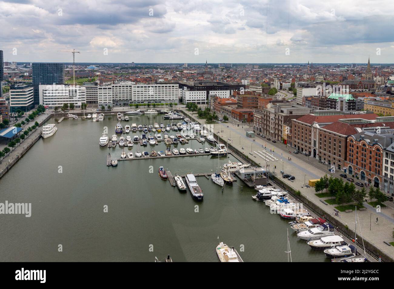 The docks on Scheldt river and the historical buildings of Antwerp ...