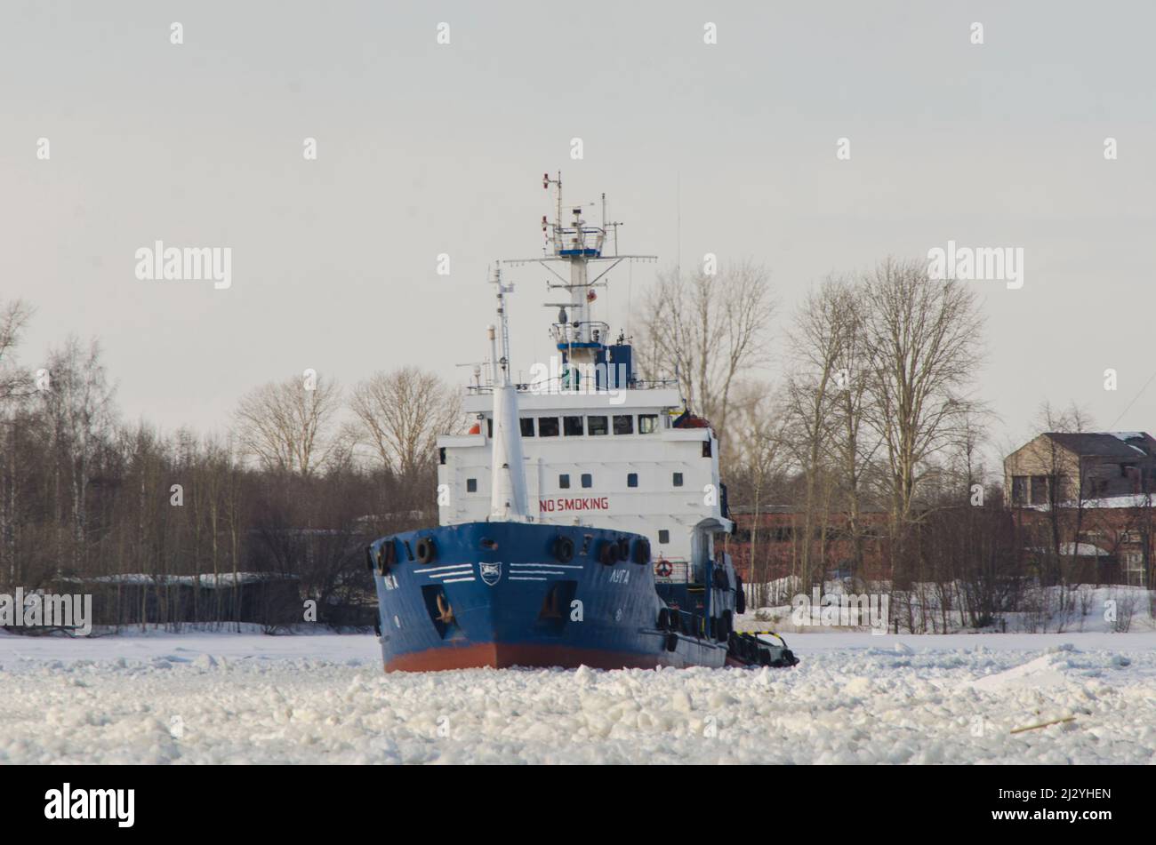 April, 2022 - Arkhangelsk. Tanker "Luga" is on the winter river. Russia ...