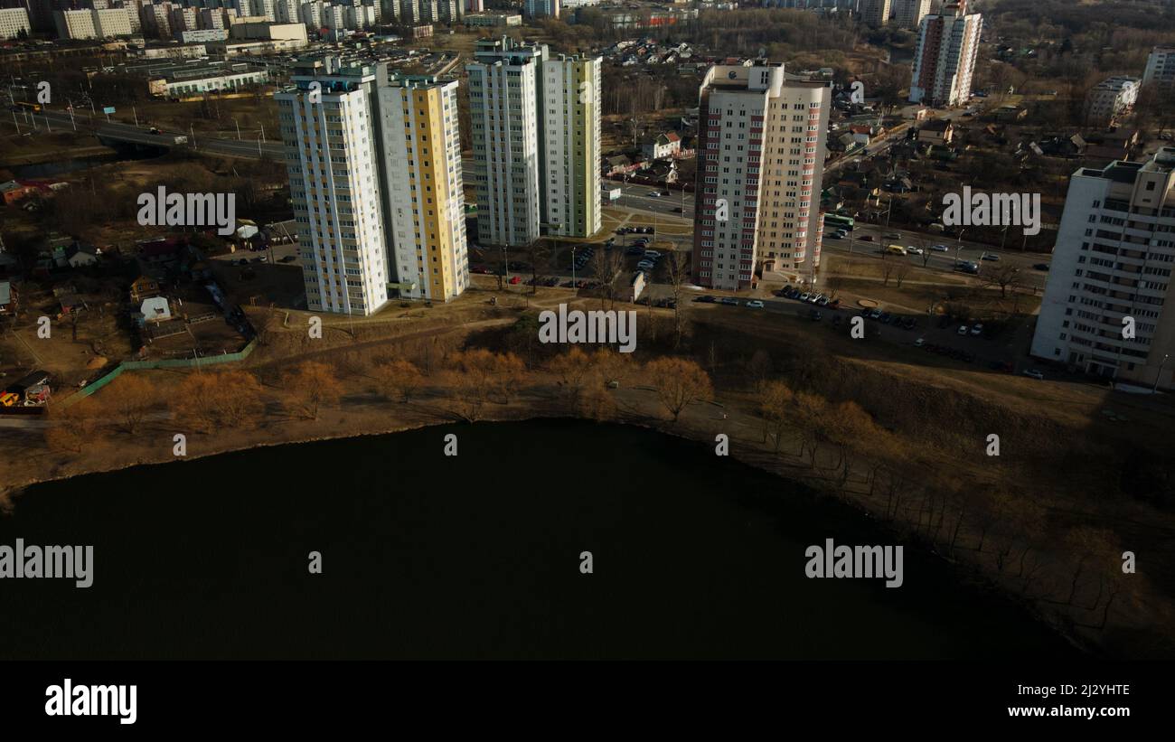 City block near the river. Multi-story houses. Water city system ...