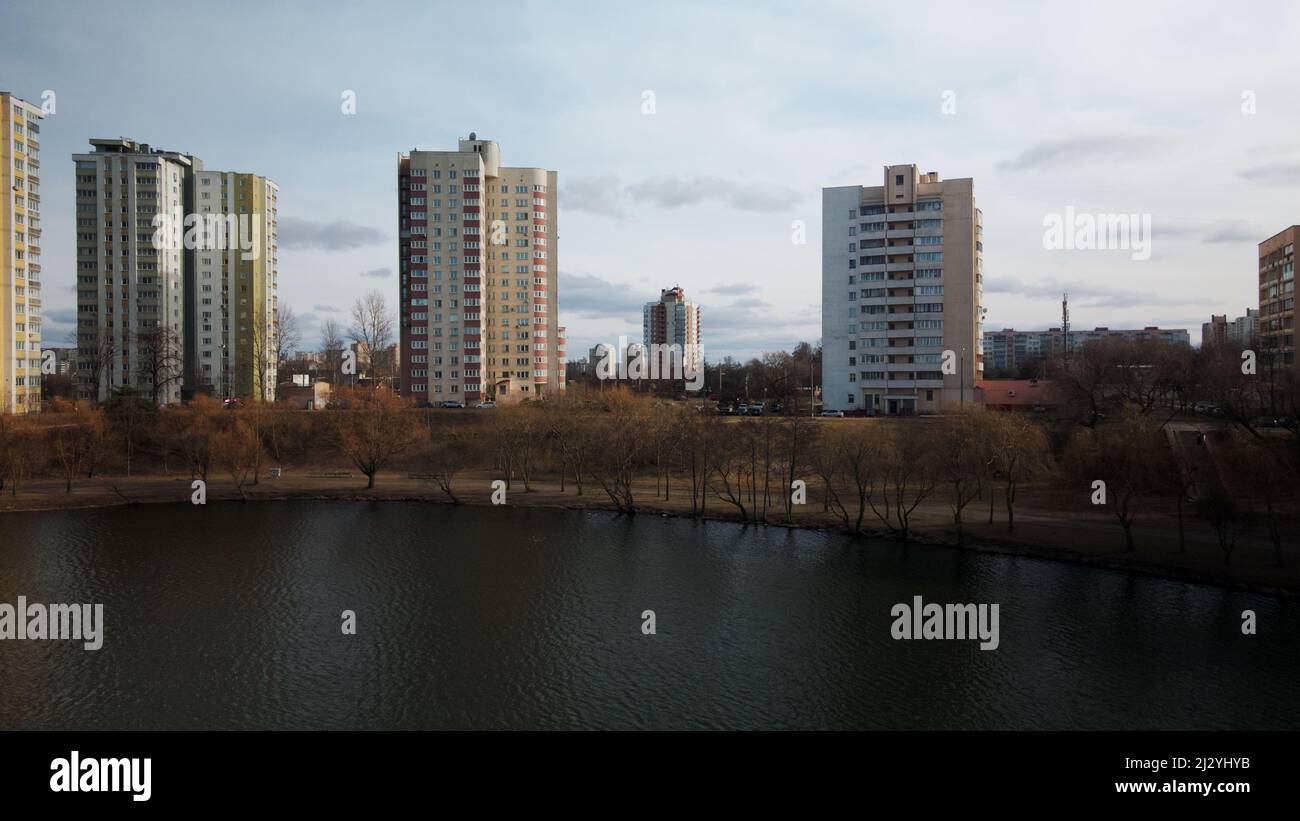 City block near the river. Multi-story houses. Water city system ...