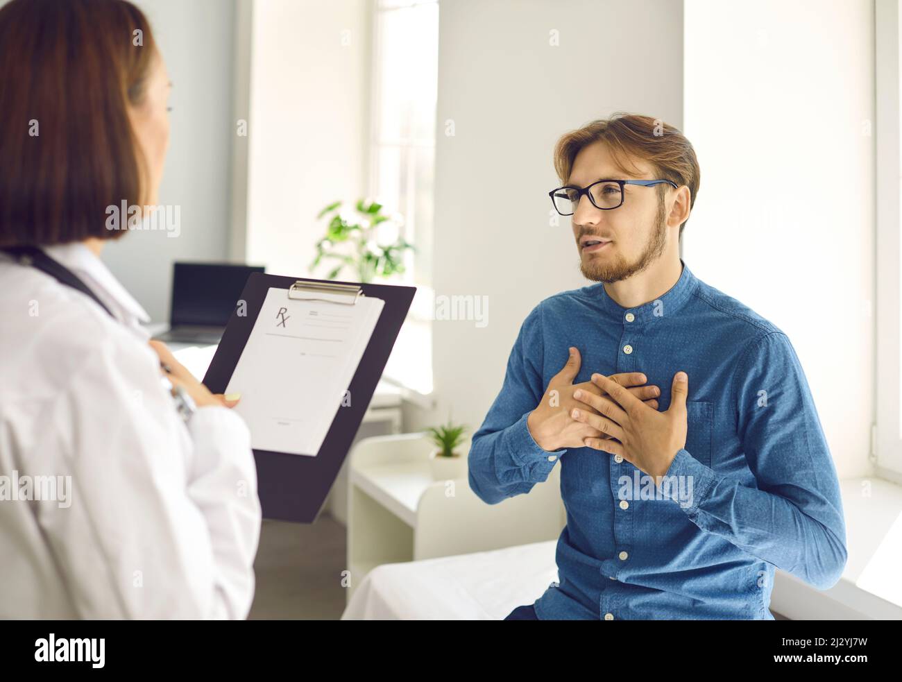 Young man chest pain hi-res stock photography and images - Alamy