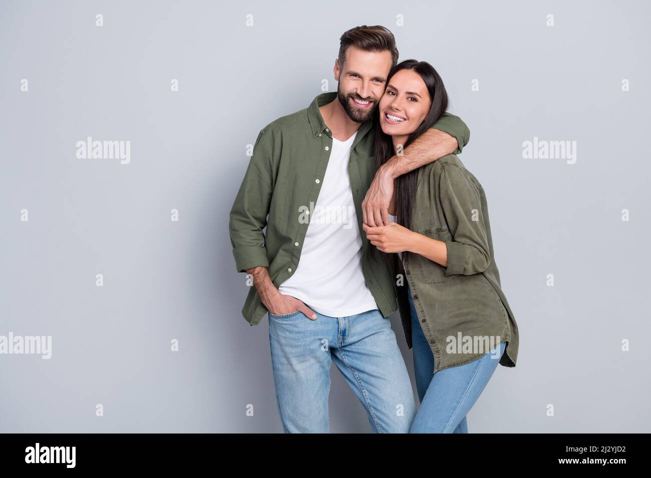 Portrait of attractive tender gentle cheerful couple life partners cuddling romance isolated ...