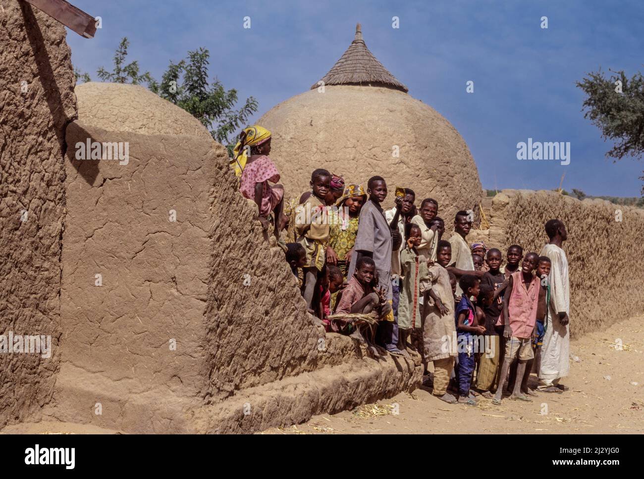 Niger, West Africa. Nigerien Villagers, Granary behind them Stock Photo ...