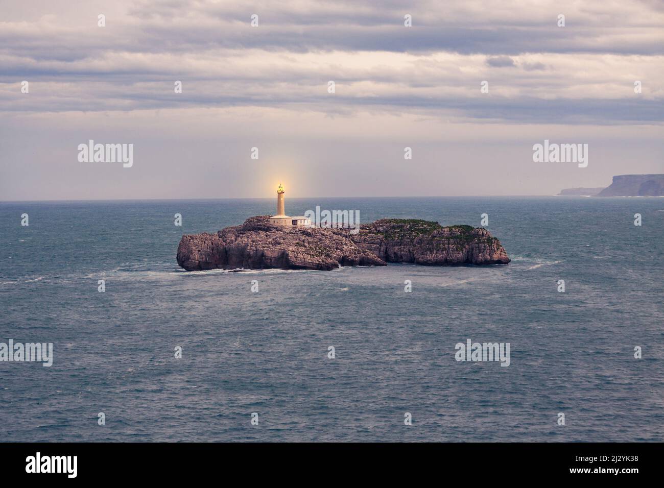 A beautiful view of the lighthouse on a rock in a sea Stock Photo - Alamy